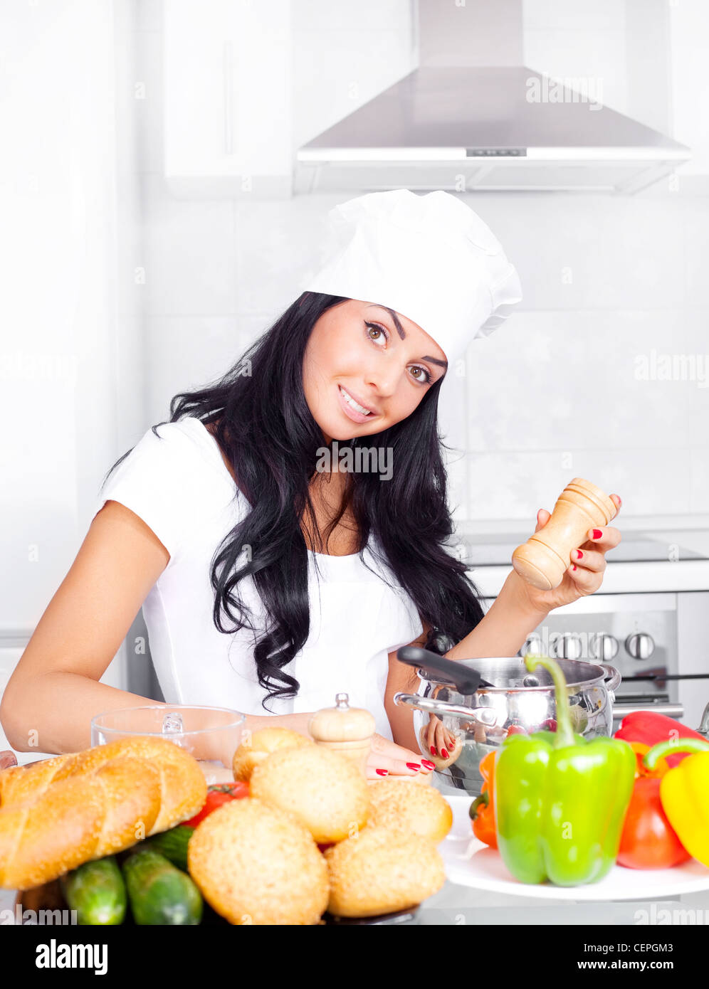 beautiful young woman cooking in the kitchen at home Stock Photo - Alamy