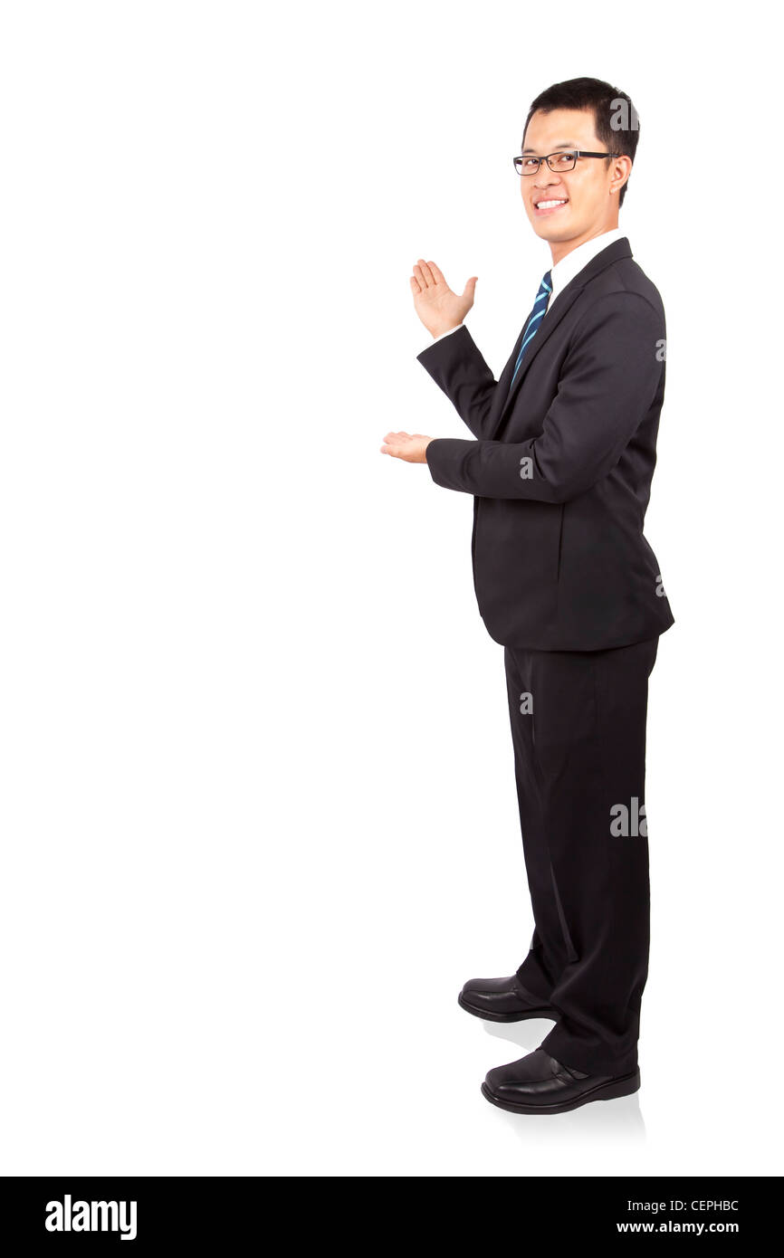 Full length portrait of a young businessman showing copyspace and ...