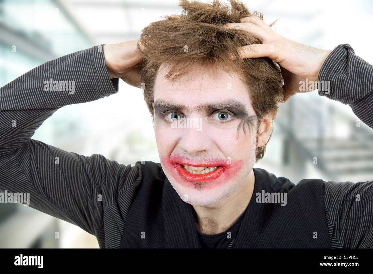 crazy young man dressed as joker Stock Photo - Alamy