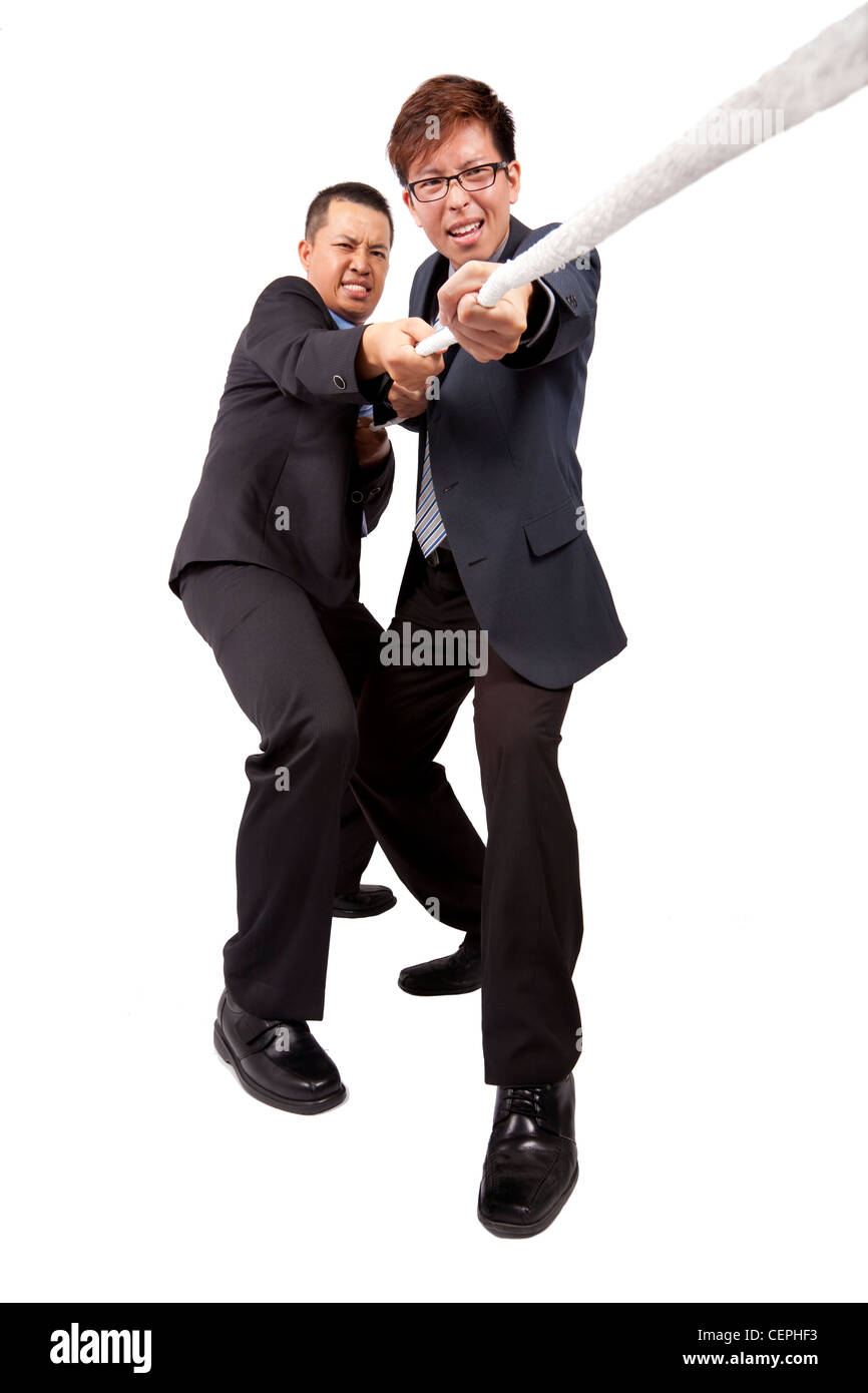 Two businessman work together and playing tug of war Stock Photo - Alamy