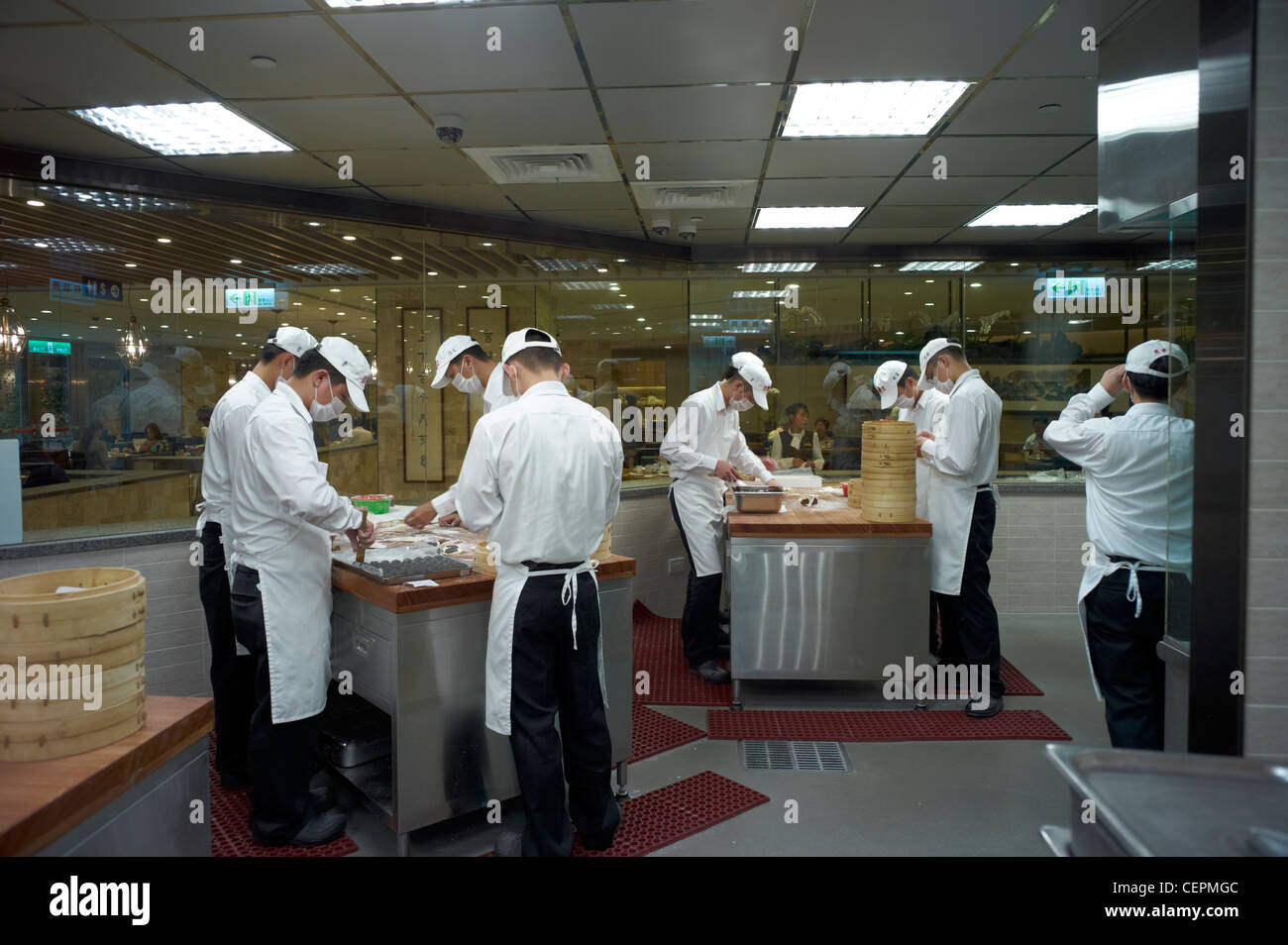 Workers in the kitchen of famed restaurant, Din Tai Fung Stock Photo ...