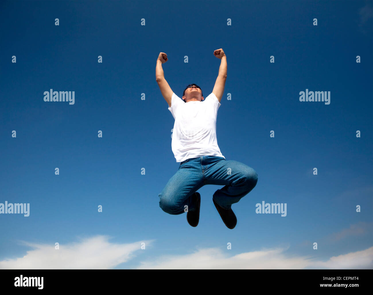 man jump in the blue sky Stock Photo - Alamy