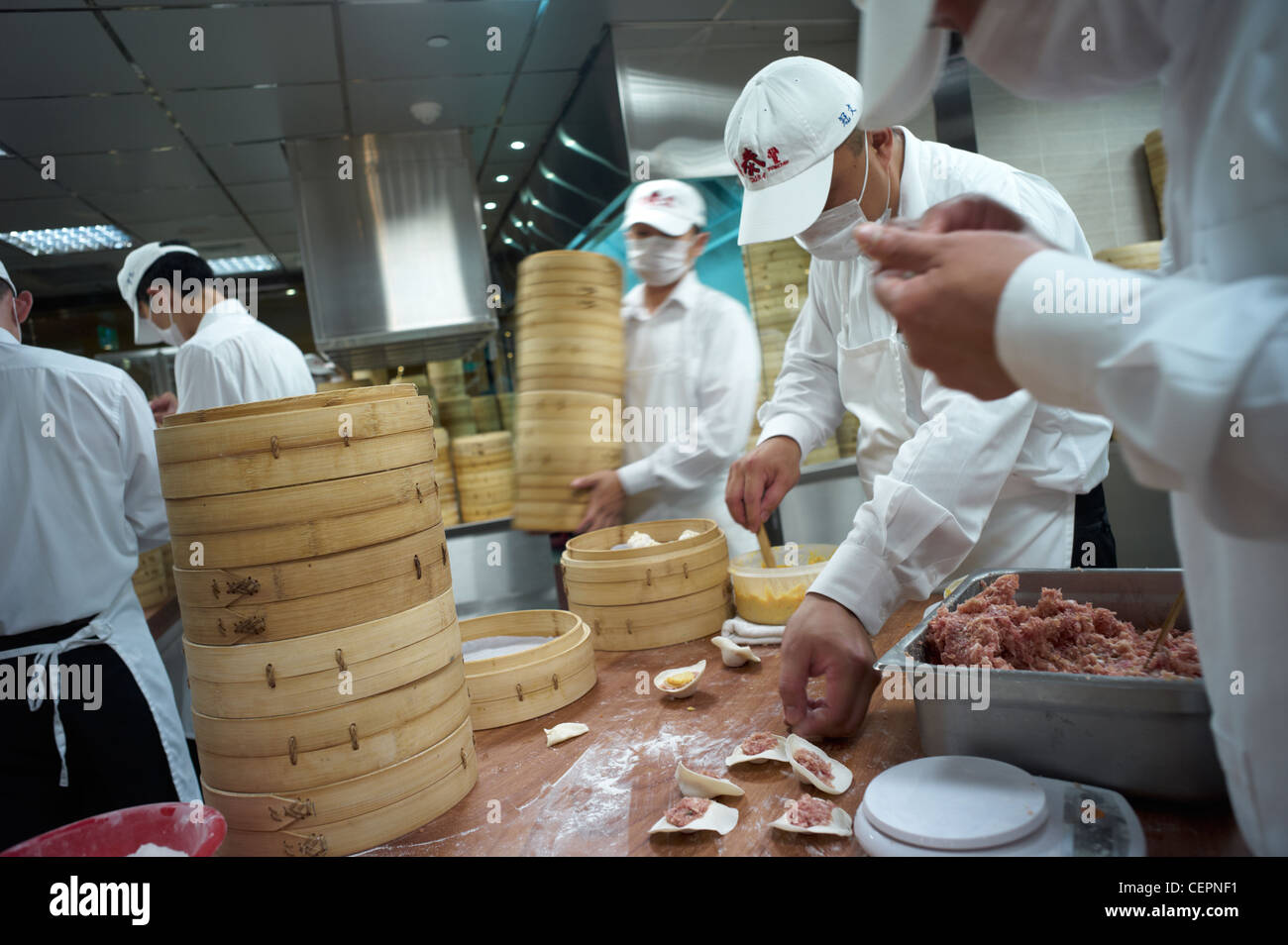 Workers in the kitchen of famed restaurant, Din Tai Fung Stock Photo ...
