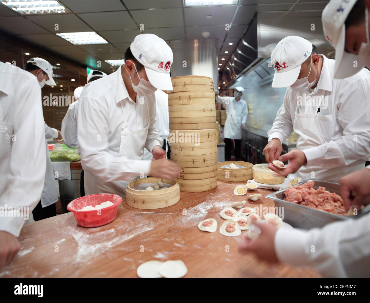 Workers in the kitchen of famed restaurant, Din Tai Fung Stock Photo ...