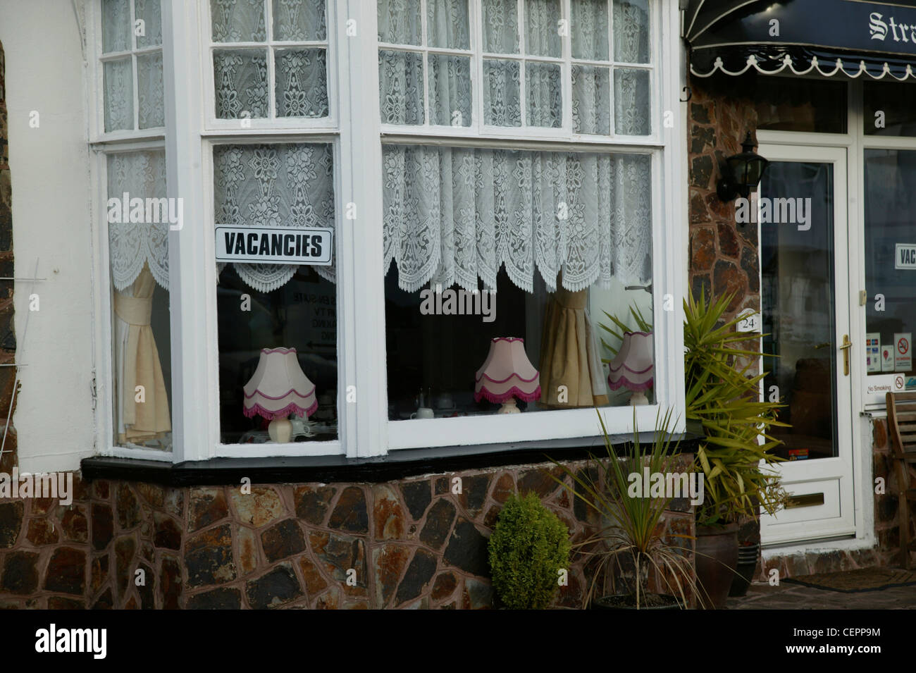 Exterior view of a typical British seaside bed and breakfast window ...