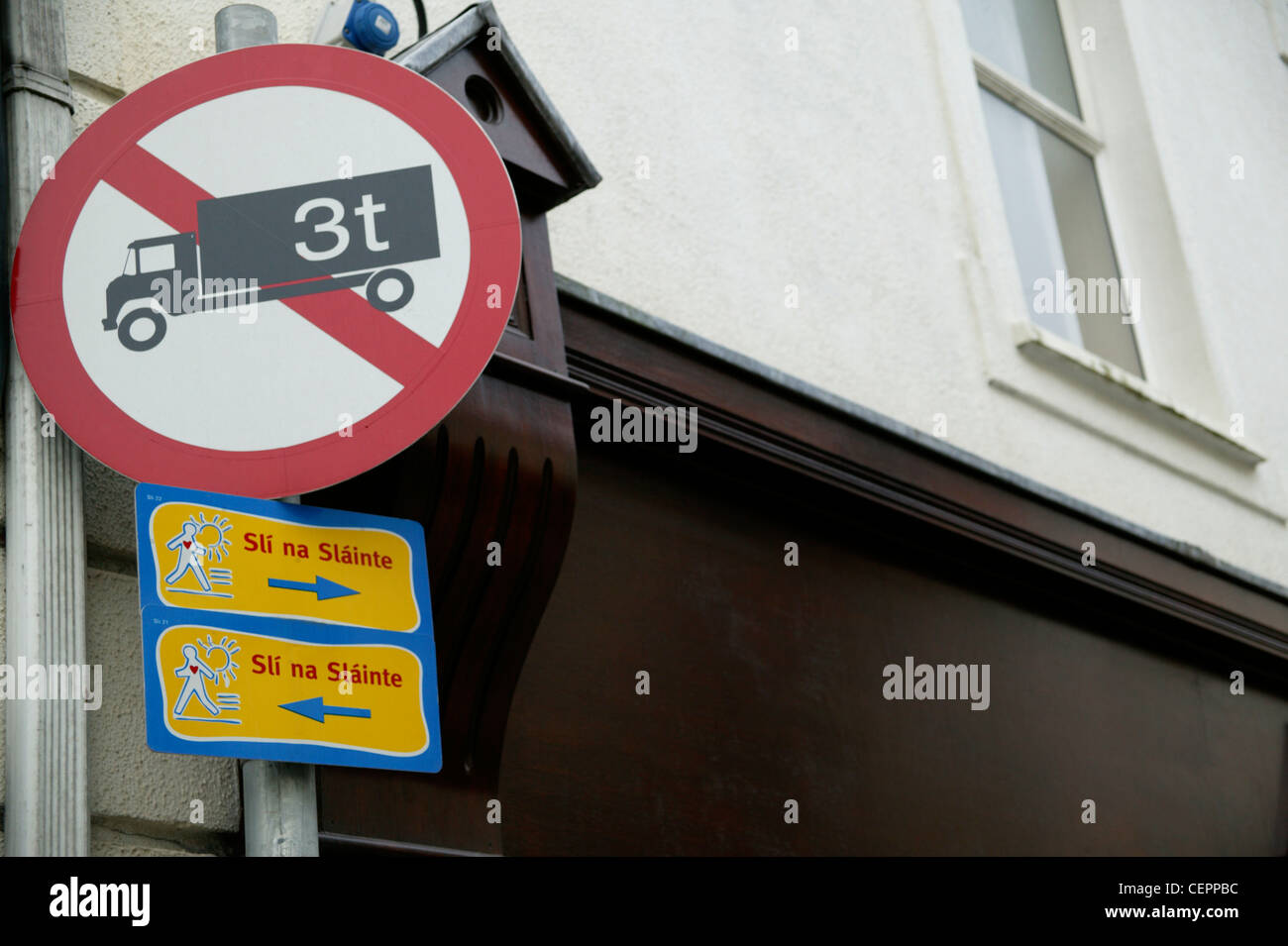 A gaelic street sign in Waterford town centre Stock Photo - Alamy