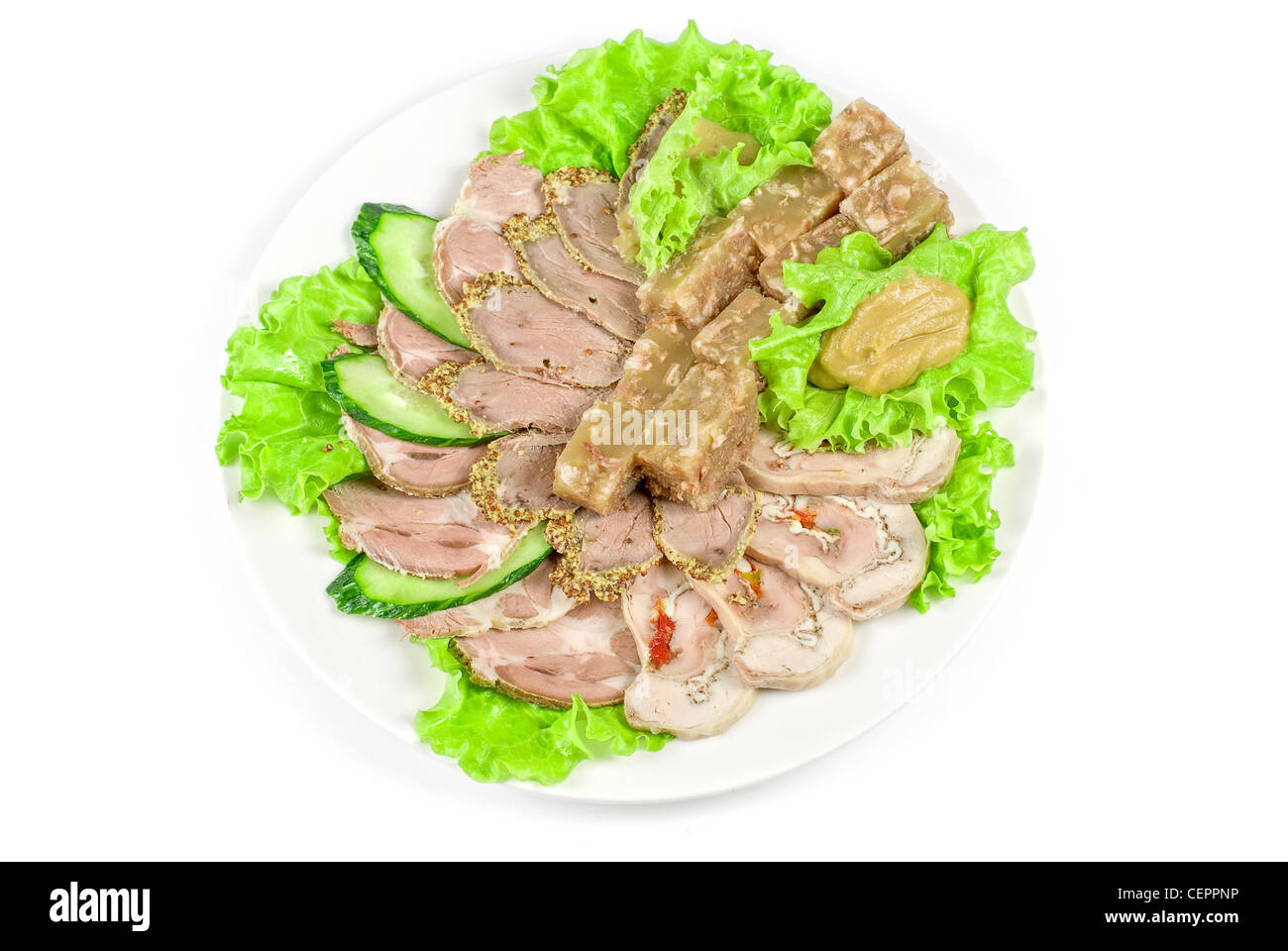 jellied minced meat and meat cuts on green salad Stock Photo - Alamy