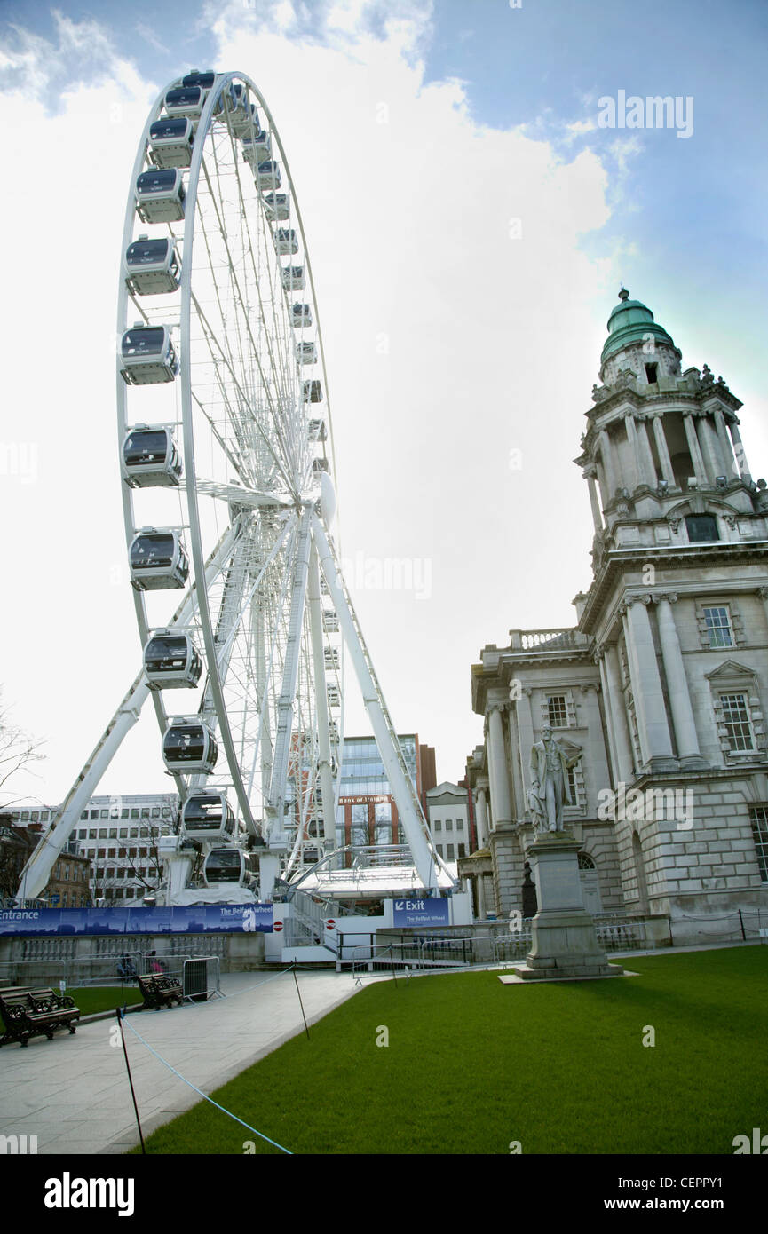 Exterior view of Belfast City Hall and the Belfast Wheel Stock Photo ...