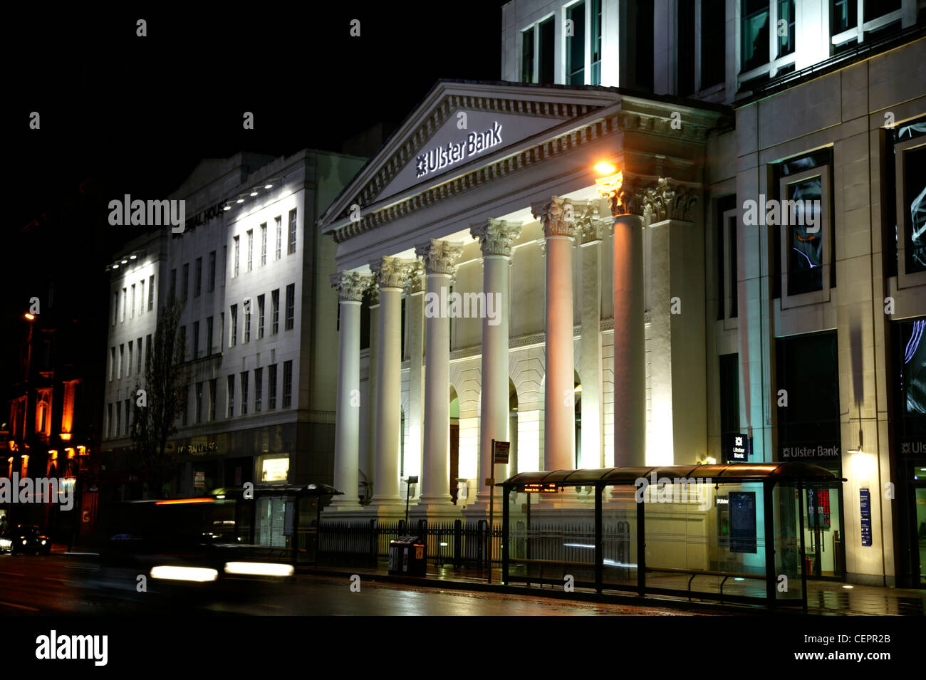 The illuminated front of Ulster Bank at night in Belfast Stock Photo ...