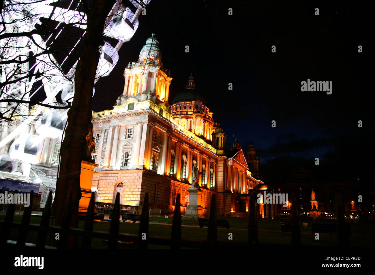 Exterior view of Belfast City Hall and the Belfast Wheel illuminated at ...