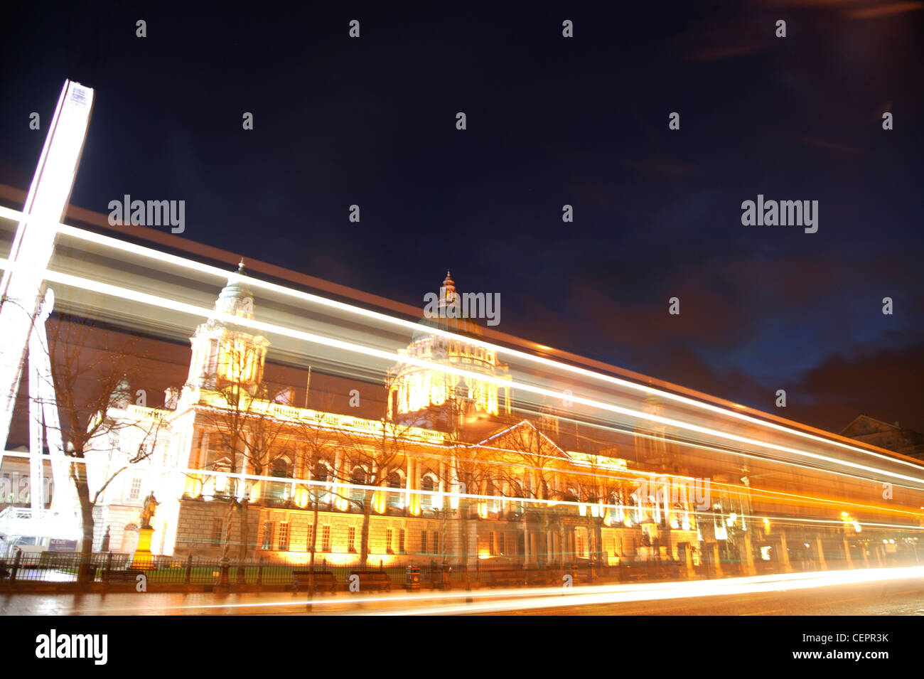 Exterior view of Belfast City Hall and the Belfast Wheel illuminated at ...