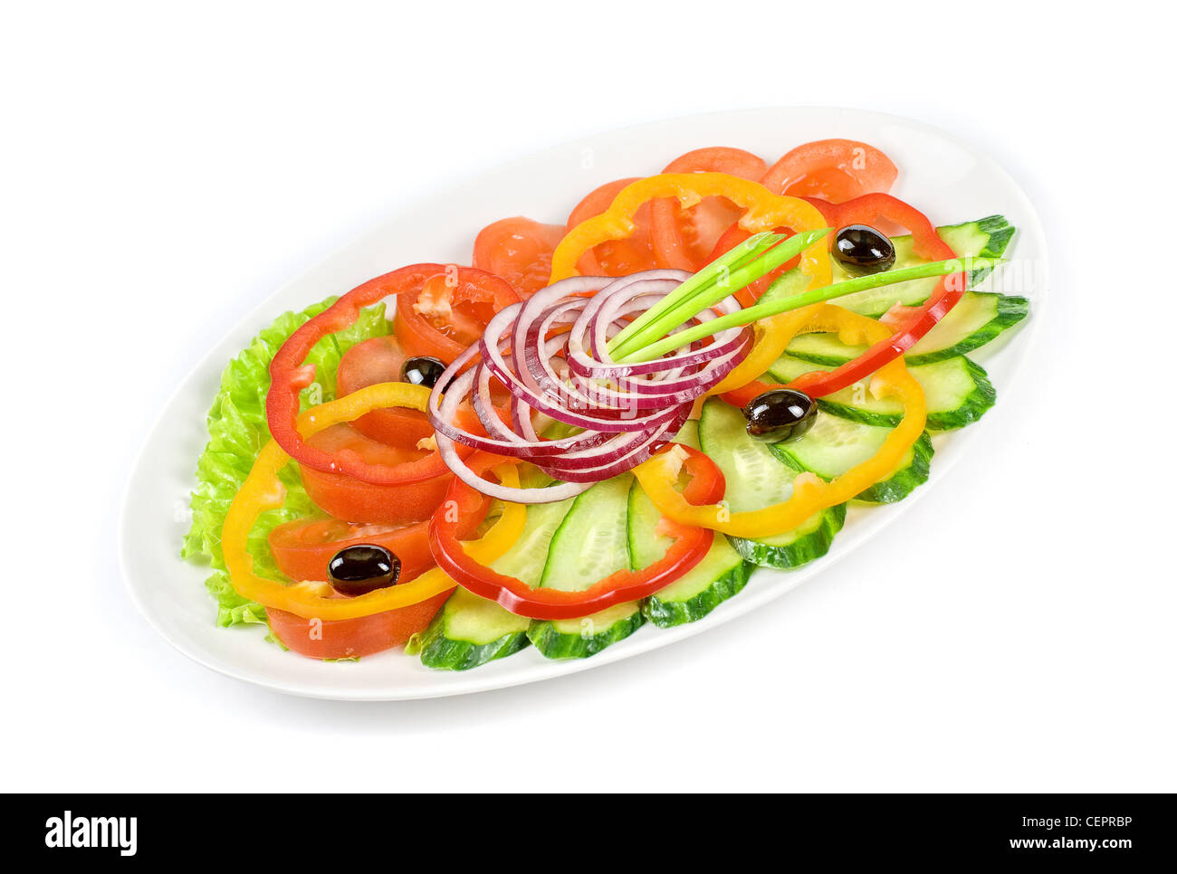 sliced vegetables at the dish isolated on a white Stock Photo - Alamy