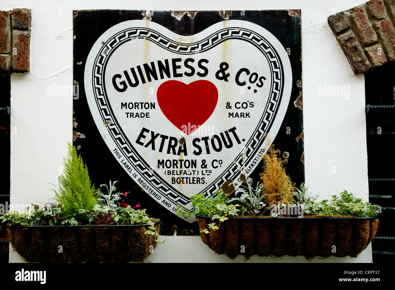 Detail of a Guinness traditional sign on the exterior a Belfast pub ...