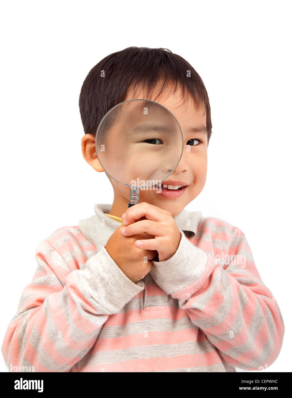 smiling boy holding magnifier Stock Photo - Alamy