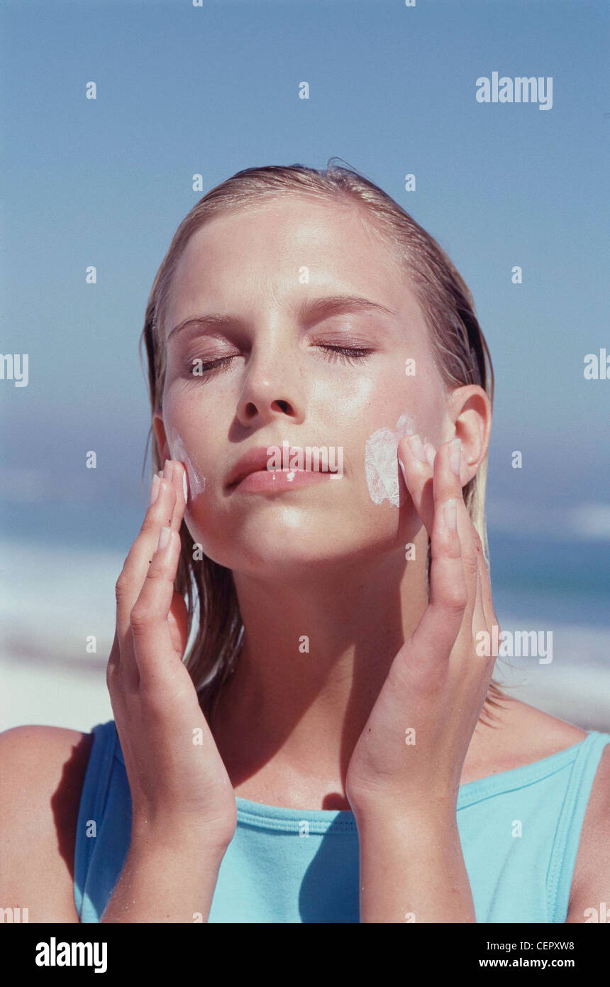 Tanned Female Wet Chin Length Blonde Hair Wearing Subtle Make Up And