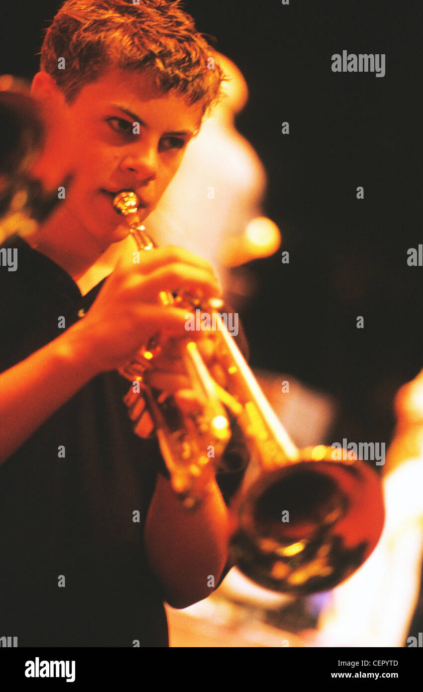 A boy playing a trumpet Stock Photo - Alamy