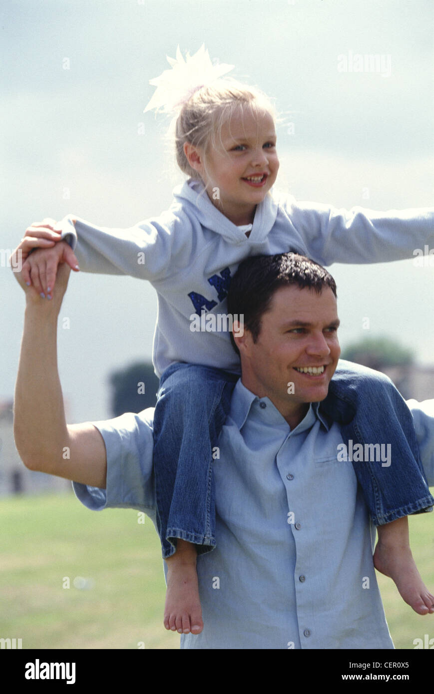 Father short brown hair wearing blue short sleeved shirt carrying ...