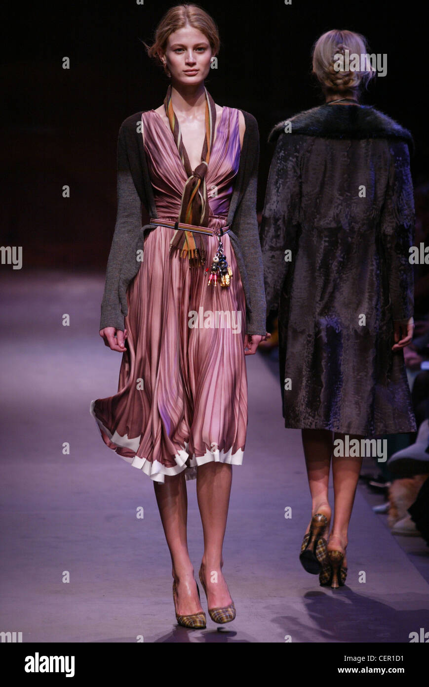 Prada Milan Autumn Winter Model brunette hair off face, wearing brown ...