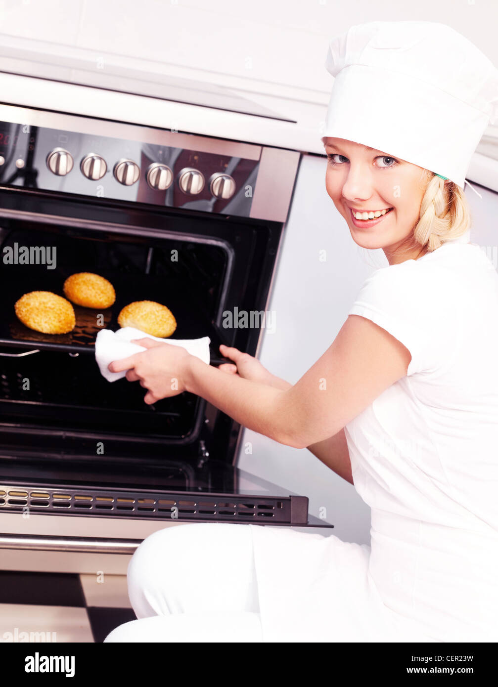 Young woman baking buns hi-res stock photography and images - Alamy