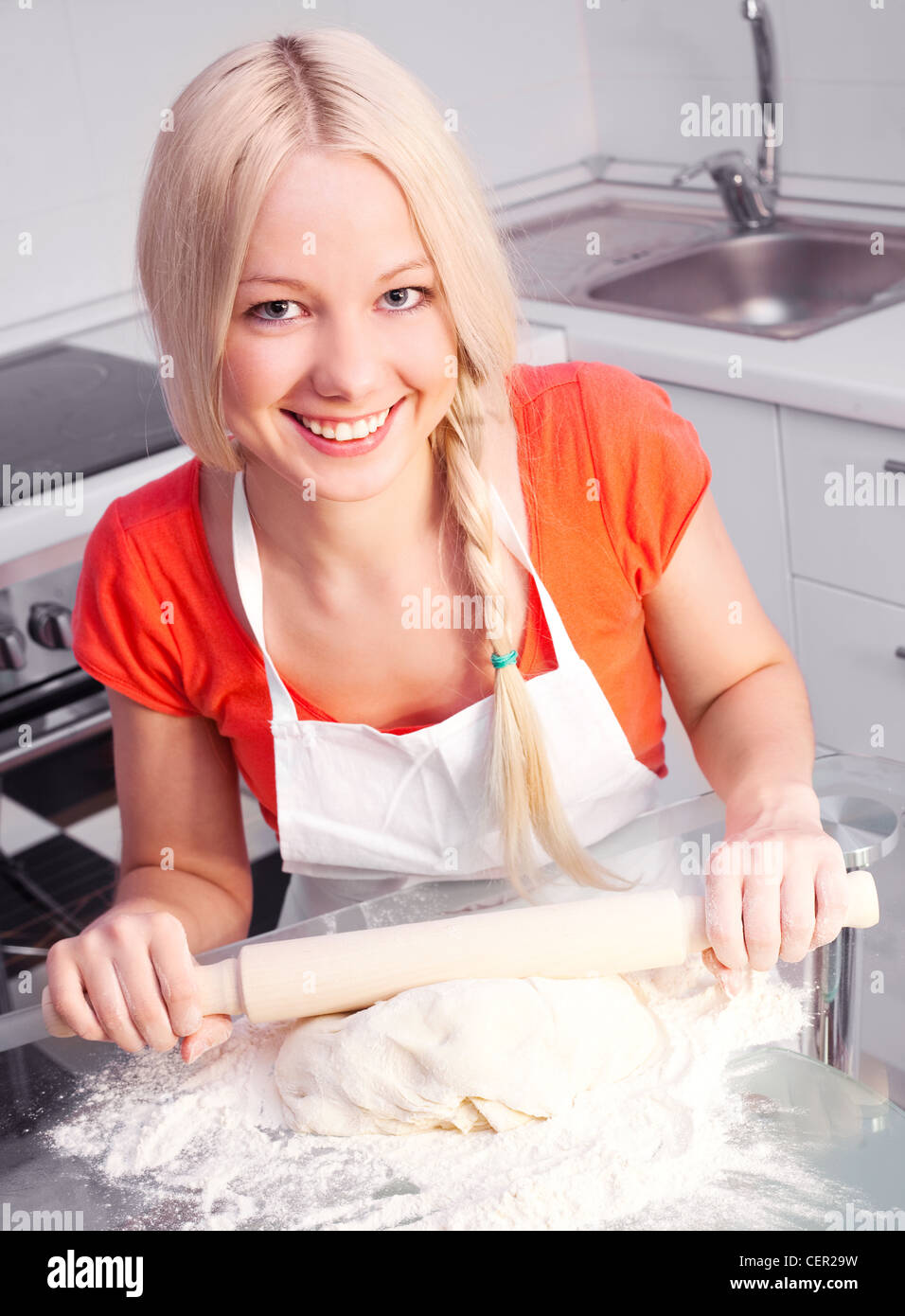 beautiful woman baking in the kitchen Stock Photo - Alamy