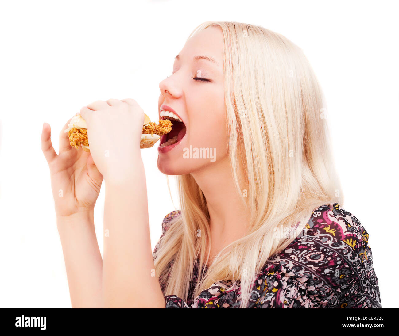 Beautiful Woman Eating A Burger Isolated Against White Background
