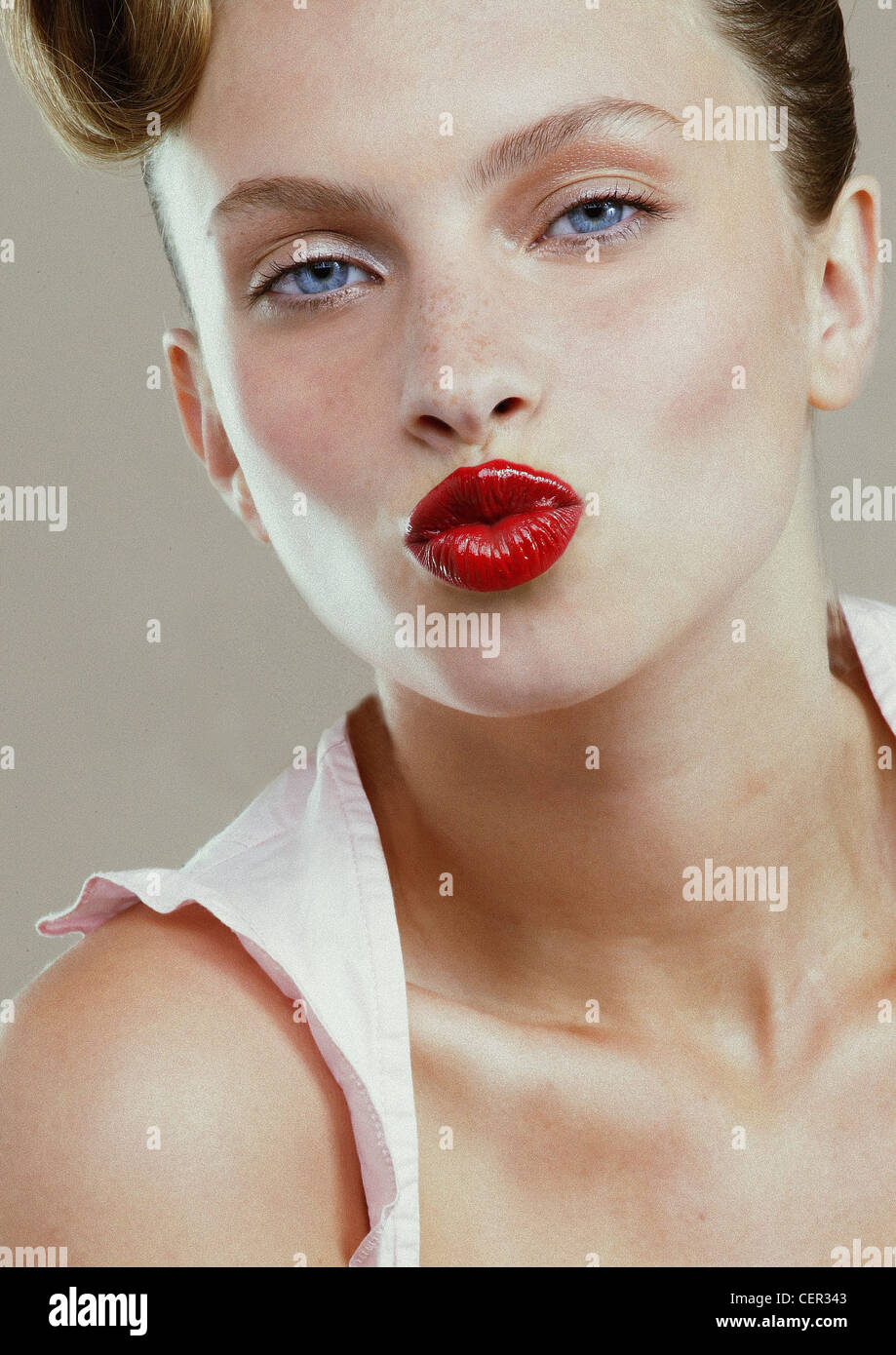 Female fair hair off face, wearing pink sleeveless top, copper ...