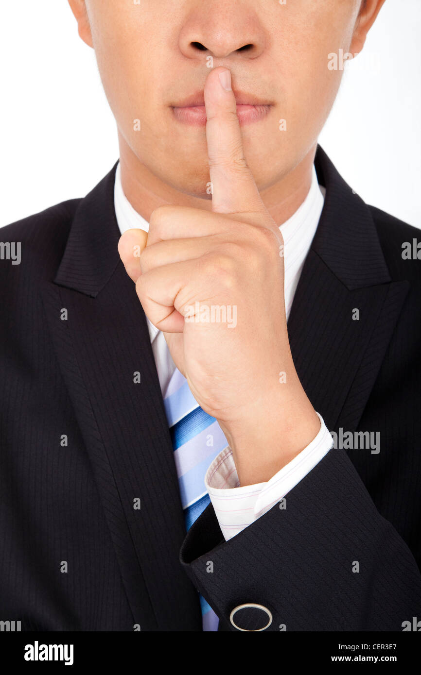 businessman showing quiet gesture with his finger Stock Photo - Alamy