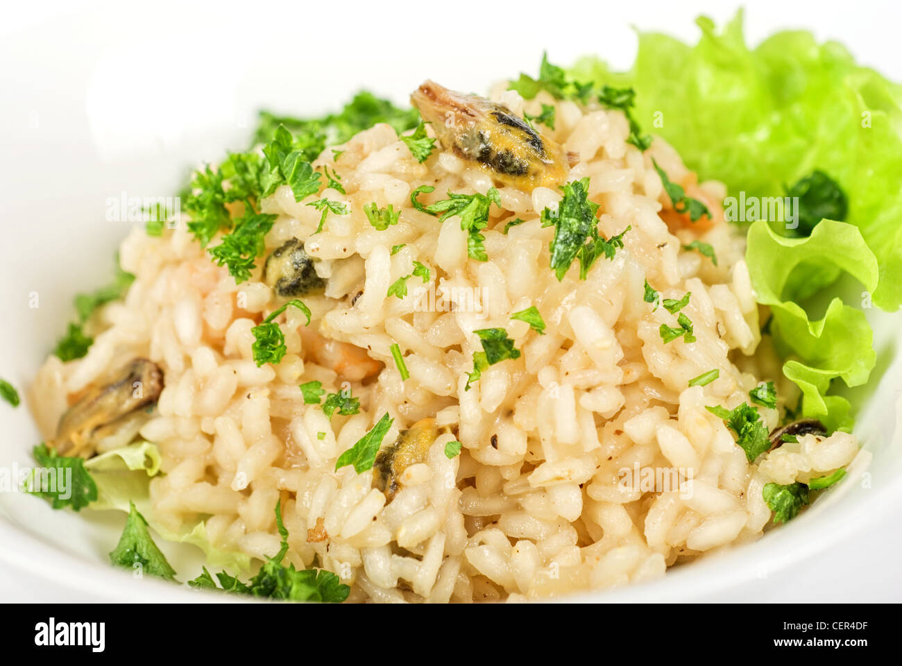 risotto with seafood isolated on a white Stock Photo - Alamy