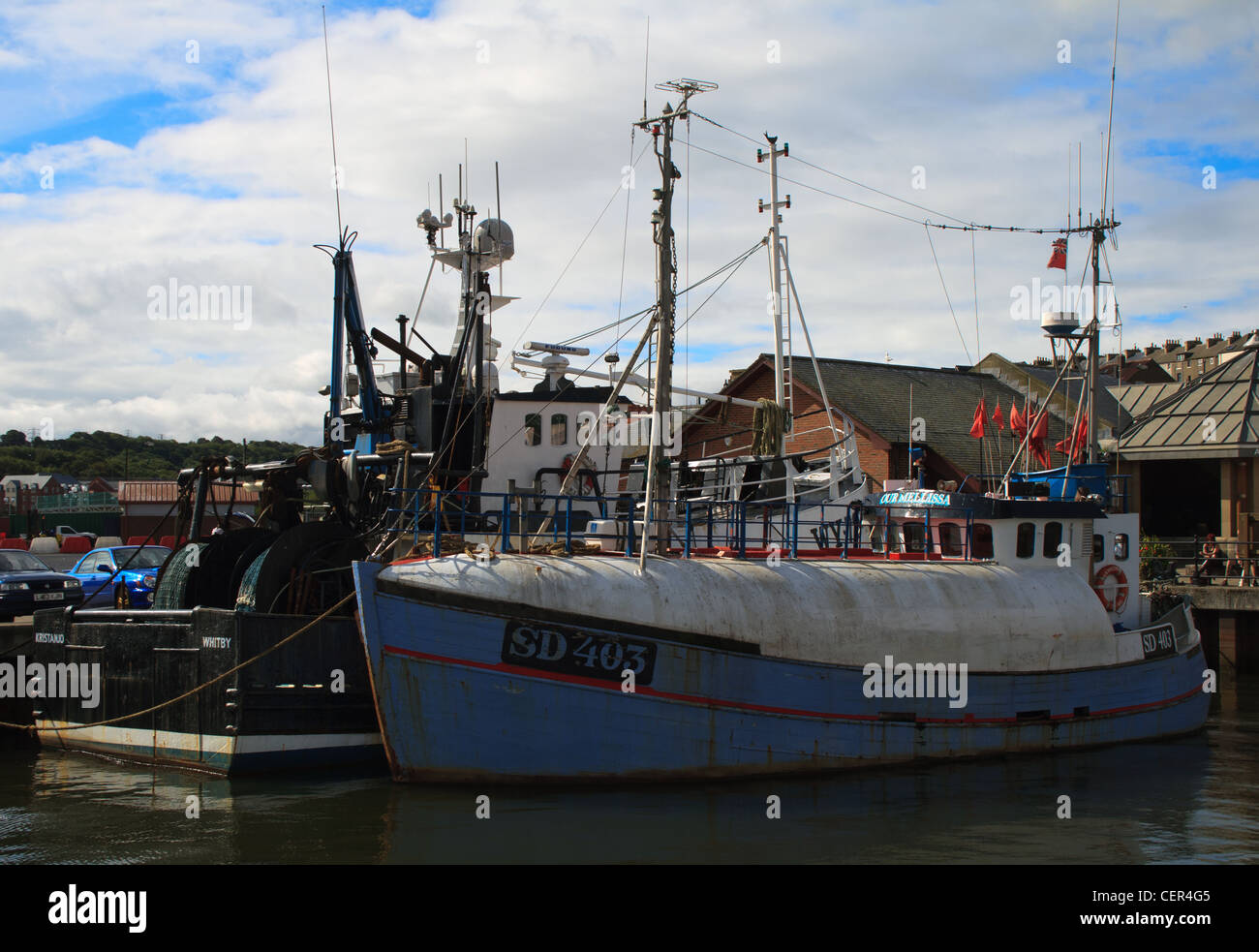 fishing boats in whitby harbour Stock Photo - Alamy