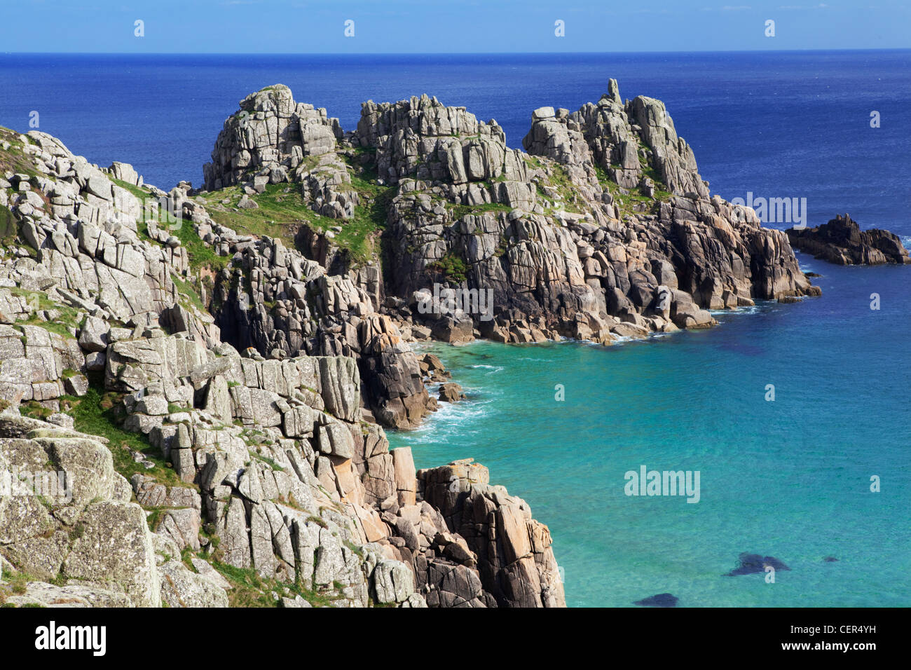 Logan Rock viewed from Treen cliffs. The cliffs and coastline around ...