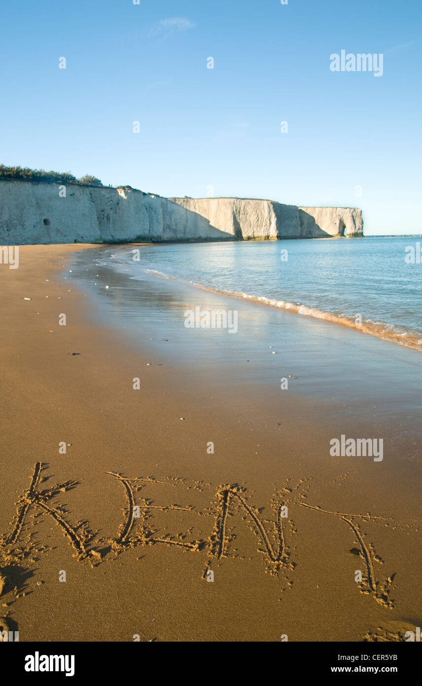 A view along the beach towards a natural hole in the chalk cliff at ...