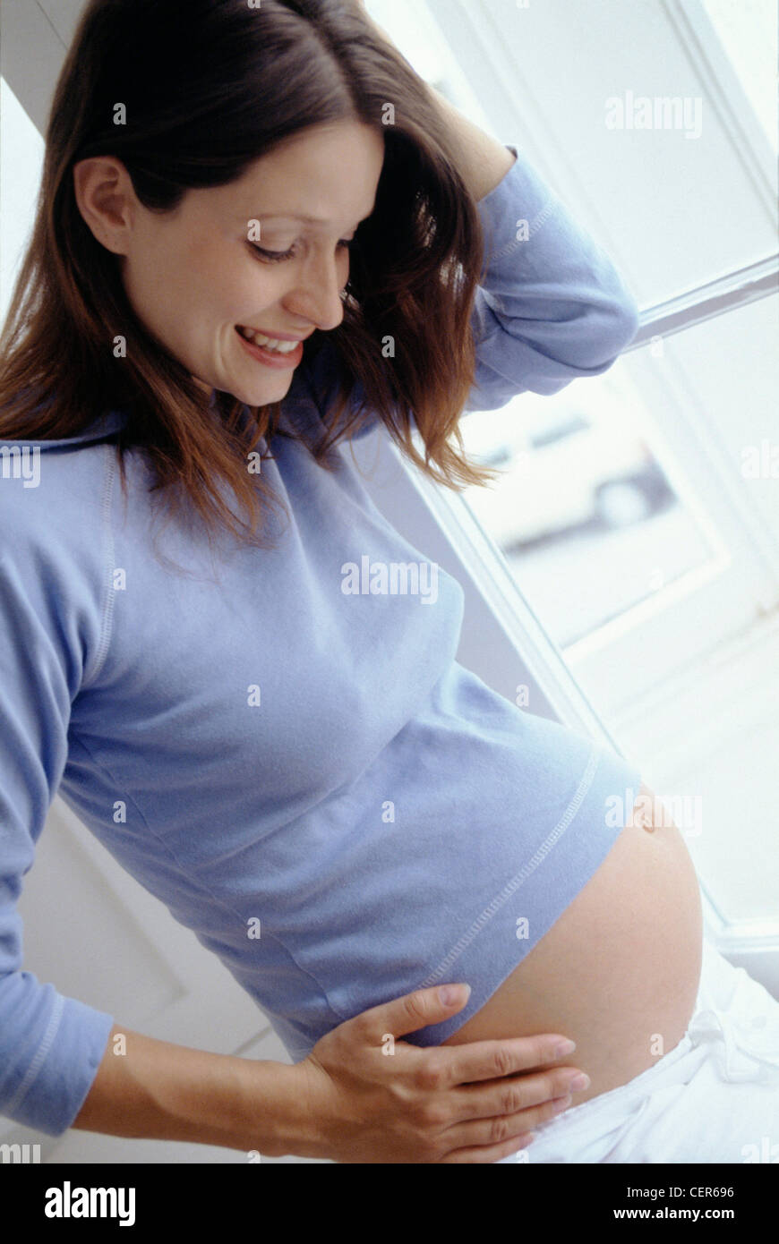 Woman in purple top wearing hi-res stock photography and images - Alamy