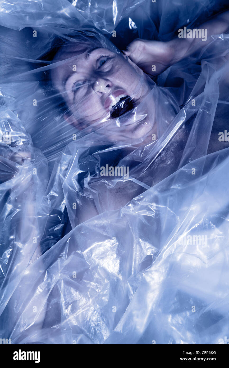 Woman under through plastic hi-res stock photography and images - Alamy