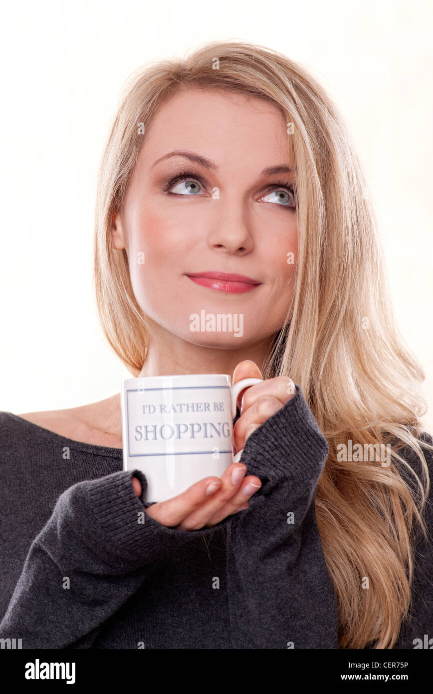 blonde woman daydreaming drinking tea Stock Photo - Alamy