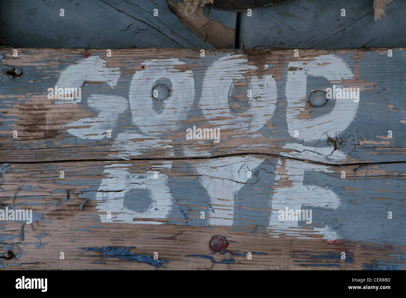 A wooden board with the words "goodbye" painted on it Stock Photo - Alamy