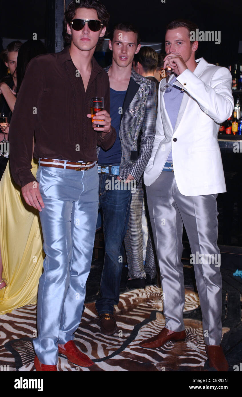 Roberto Cavalli Milan Menswear S S Three male models backstage, two ...