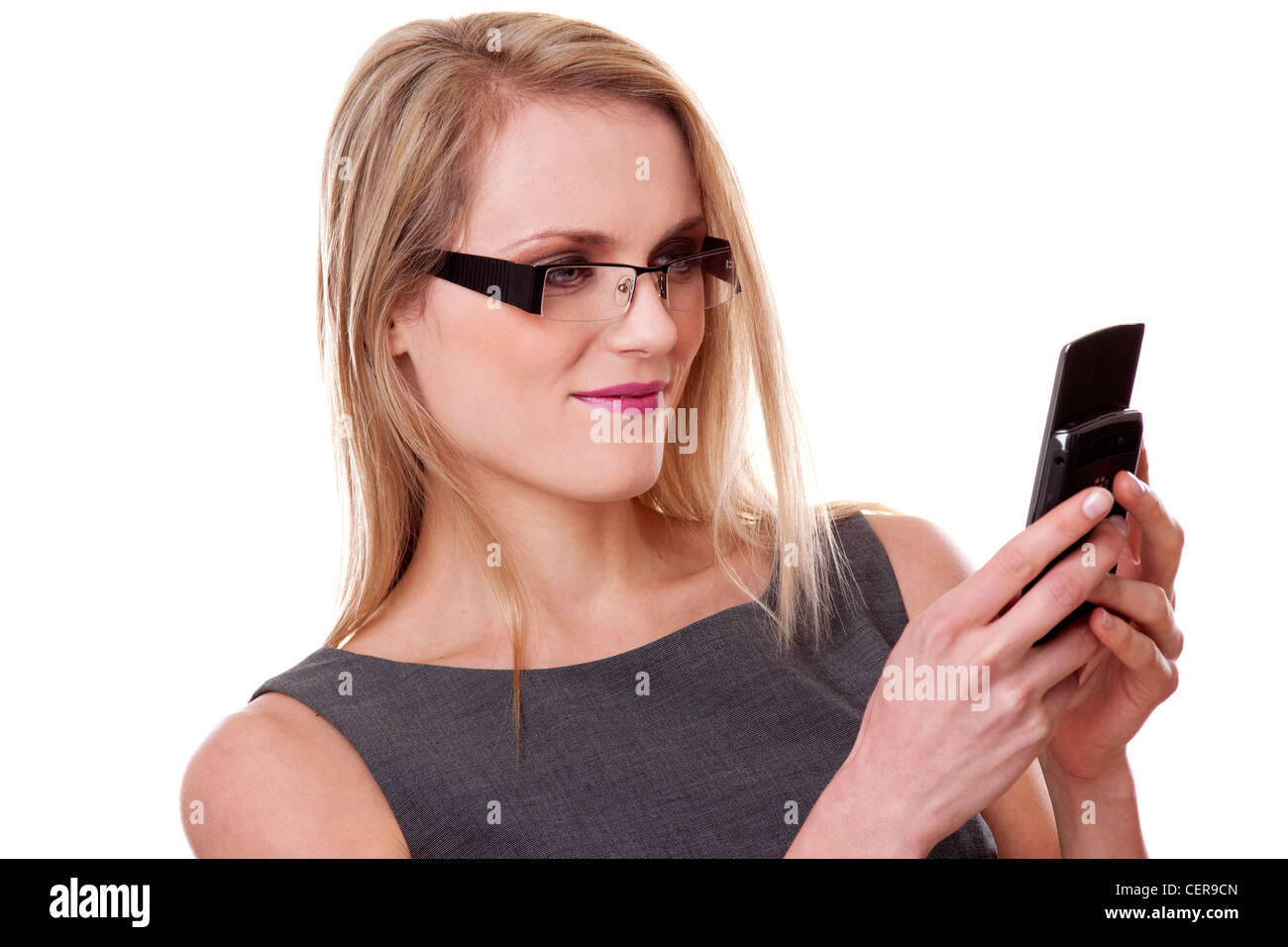 blonde woman sending a text message or email Stock Photo - Alamy
