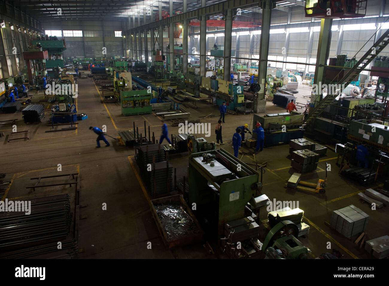 Employees make security doors in a factory of Wang Li Group, in ...
