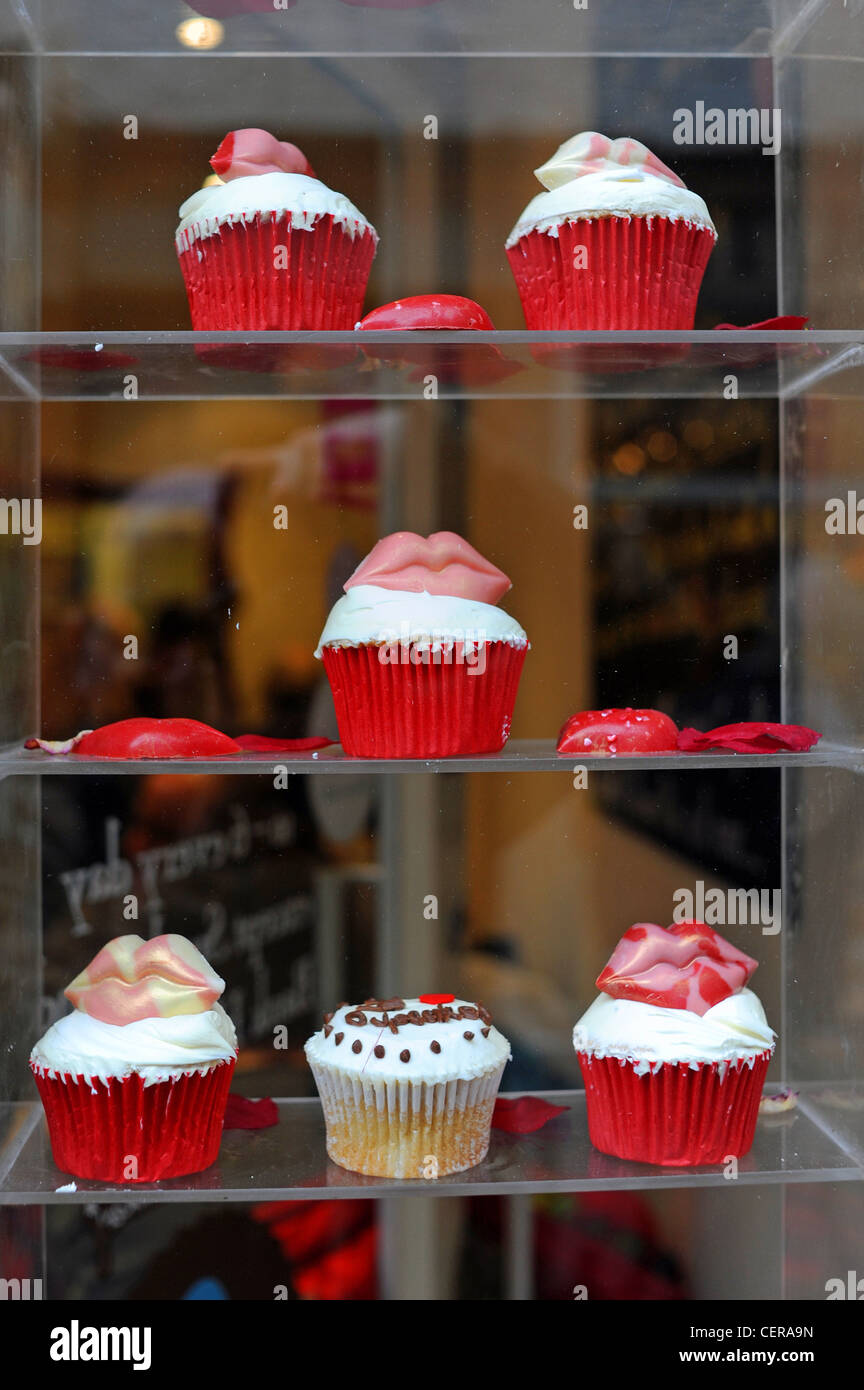 Cupcakes on display in a shop window in The Lanes area of Brighton UK ...