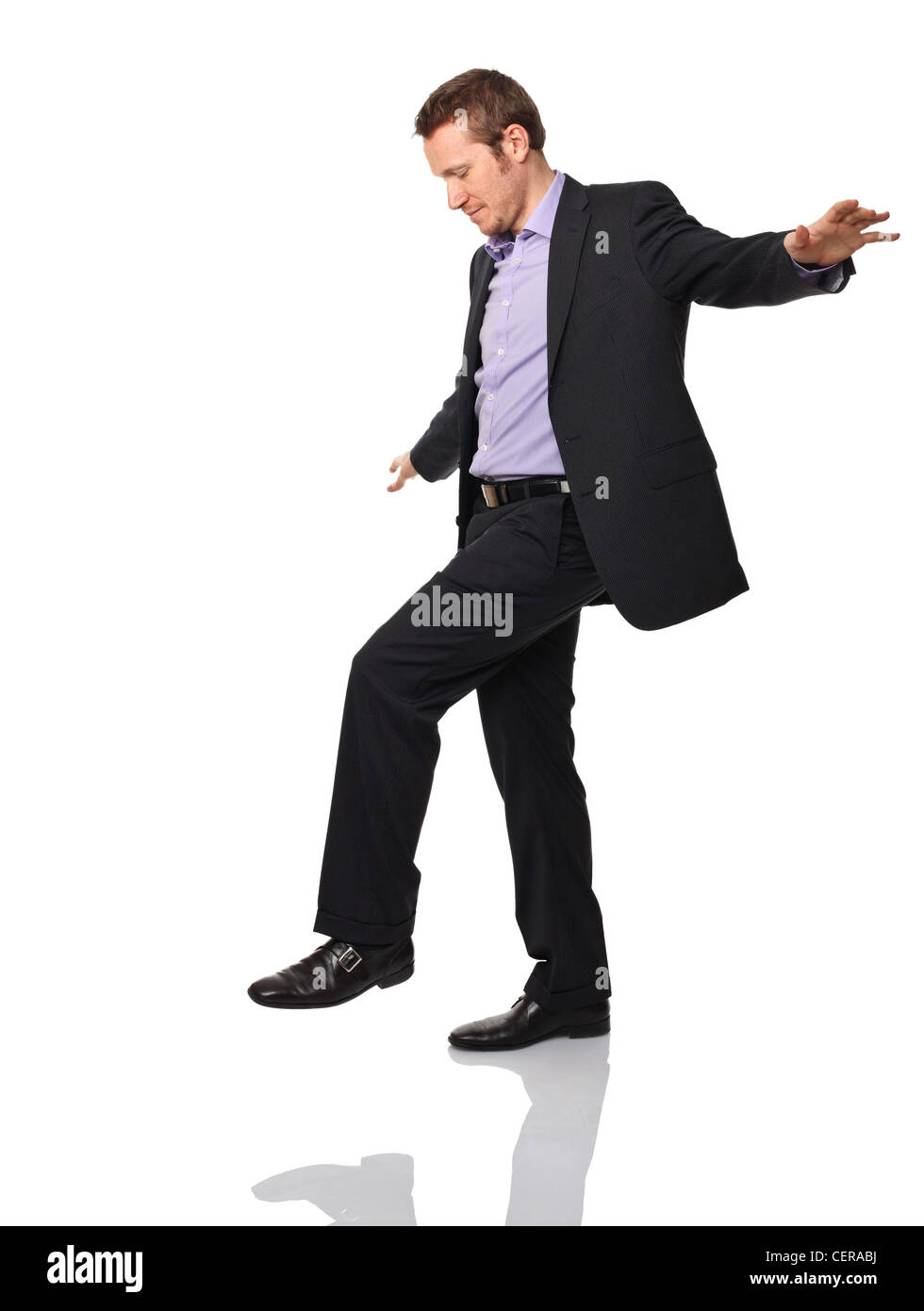 business man in acrobat pose Stock Photo - Alamy