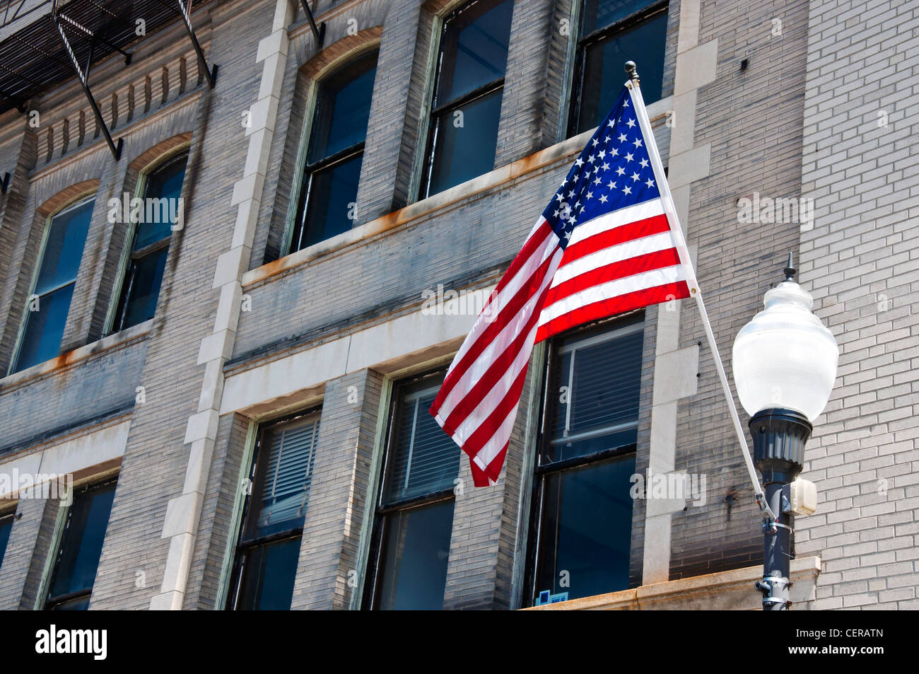 american flag flying on the building Stock Photo - Alamy