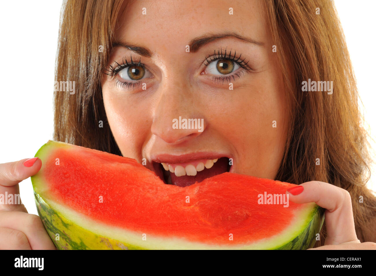 Woman eating a slice of watermelon Stock Photo - Alamy