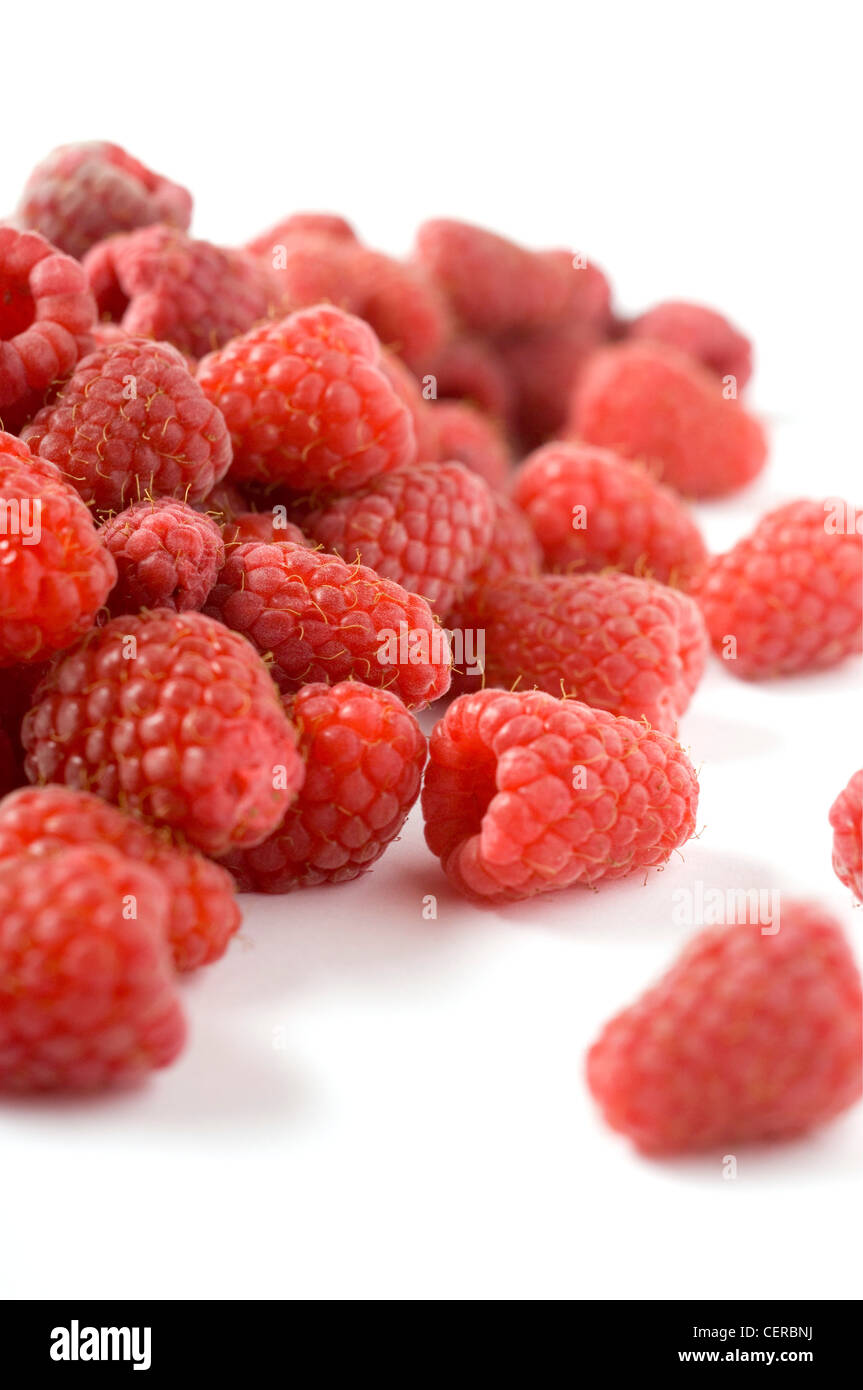 A pile of fresh raspberries on a white background Stock Photo - Alamy
