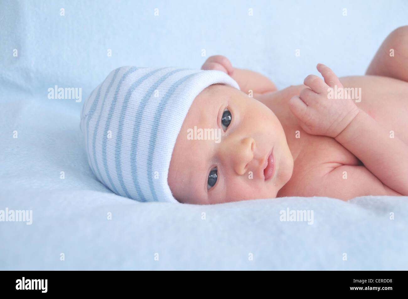 Newborn baby boy in blue Stock Photo - Alamy