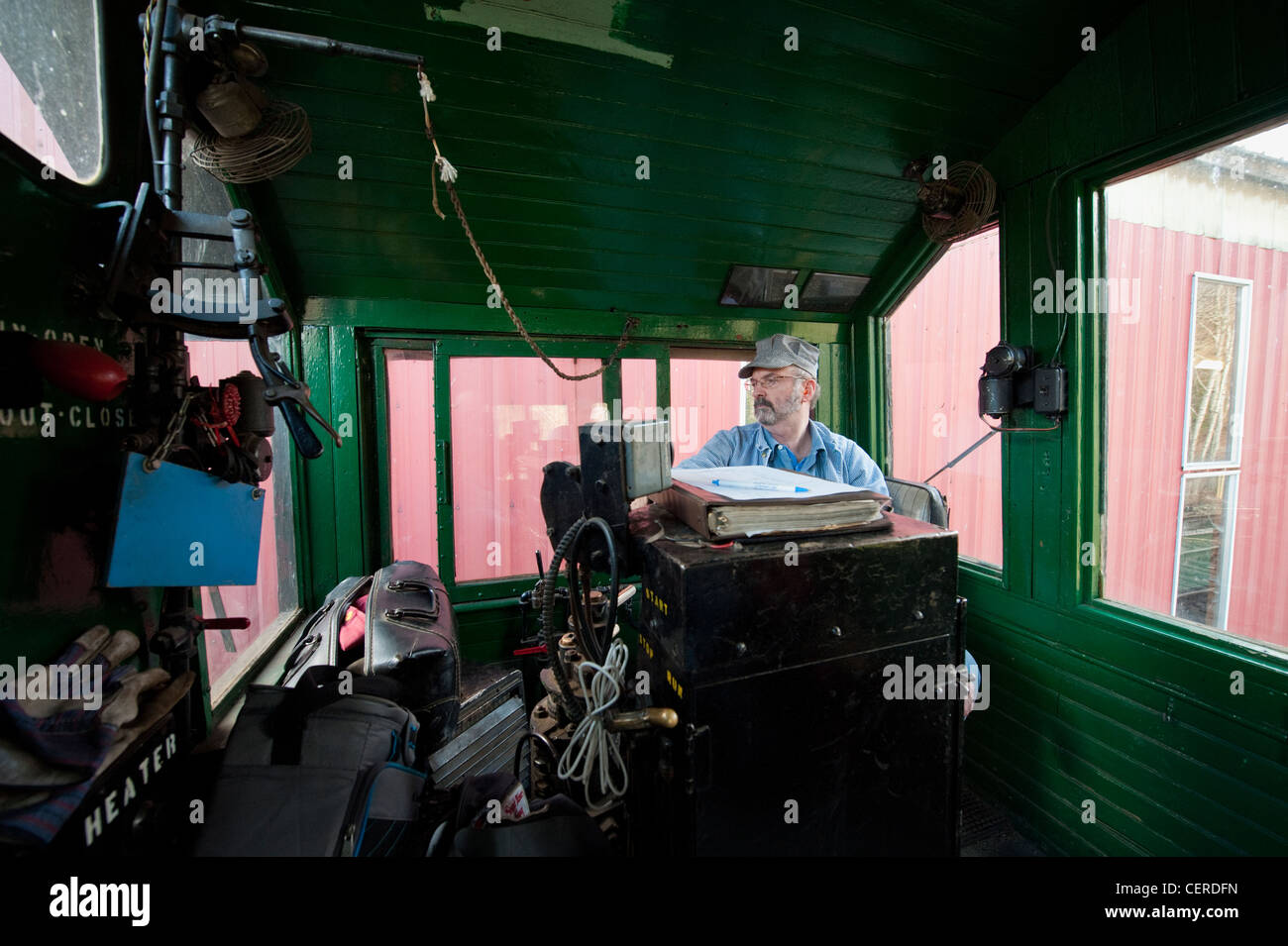 A train engineer driving an antique diesel locomotive on the Lake ...