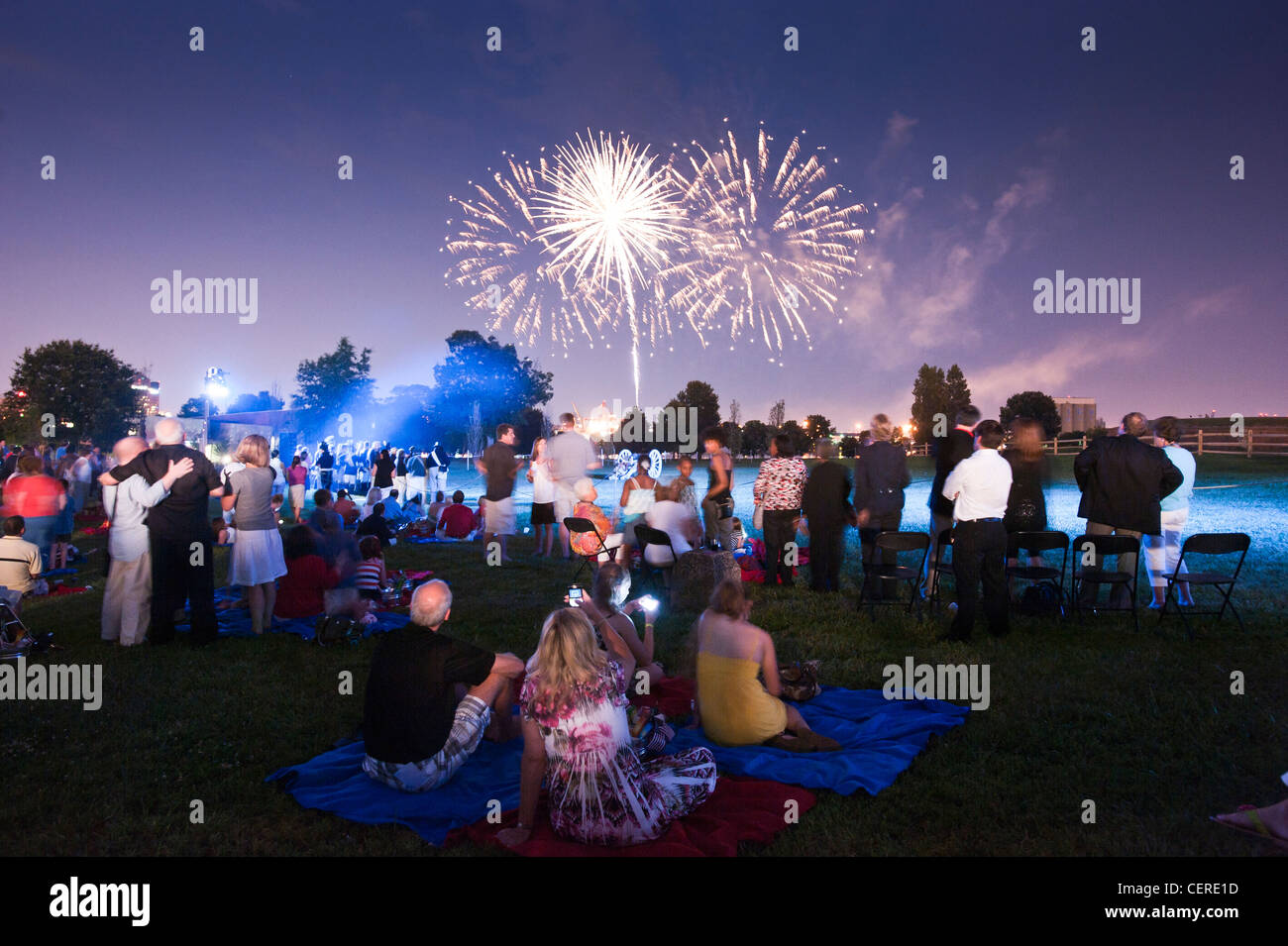 People watching fireworks display Stock Photo - Alamy