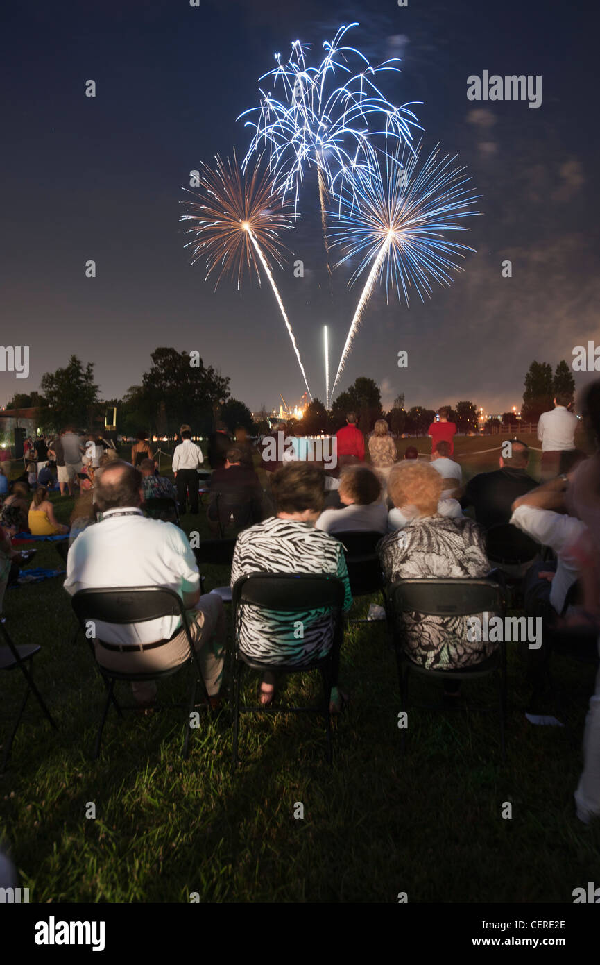 People watching fireworks display Stock Photo - Alamy