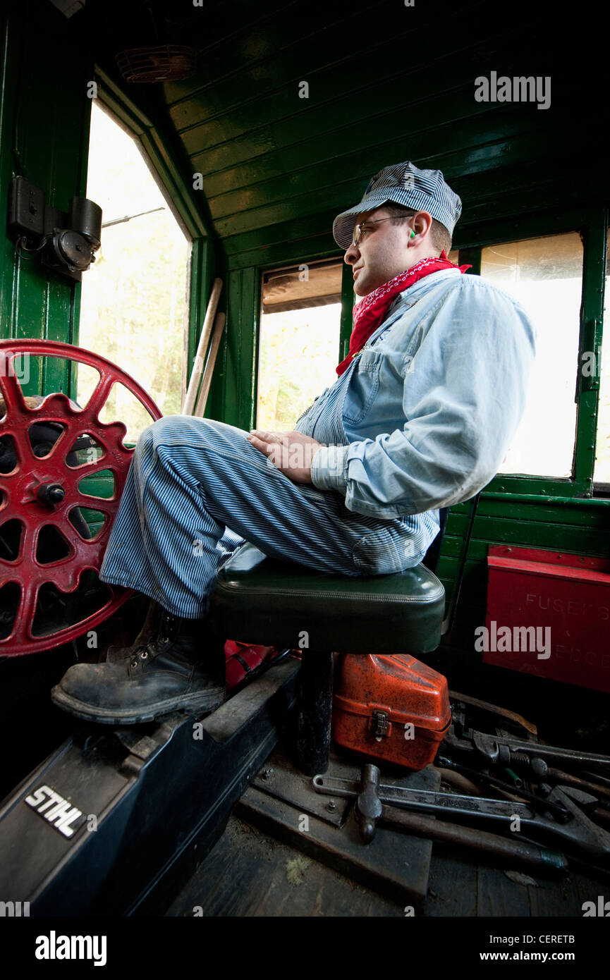 A train engineer driving an antique diesel locomotive on the Lake ...