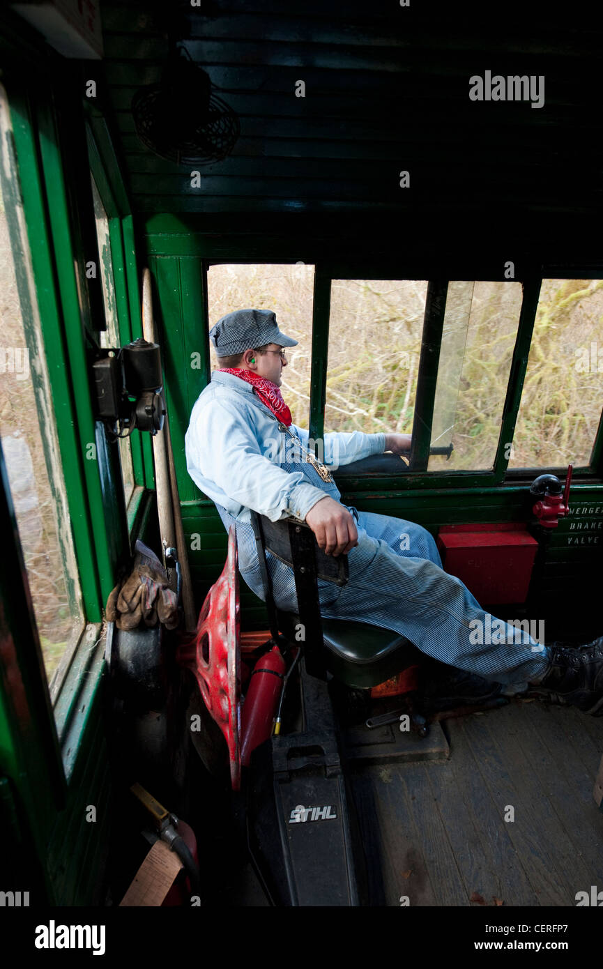 A train engineer driving an antique diesel locomotive on the Lake ...