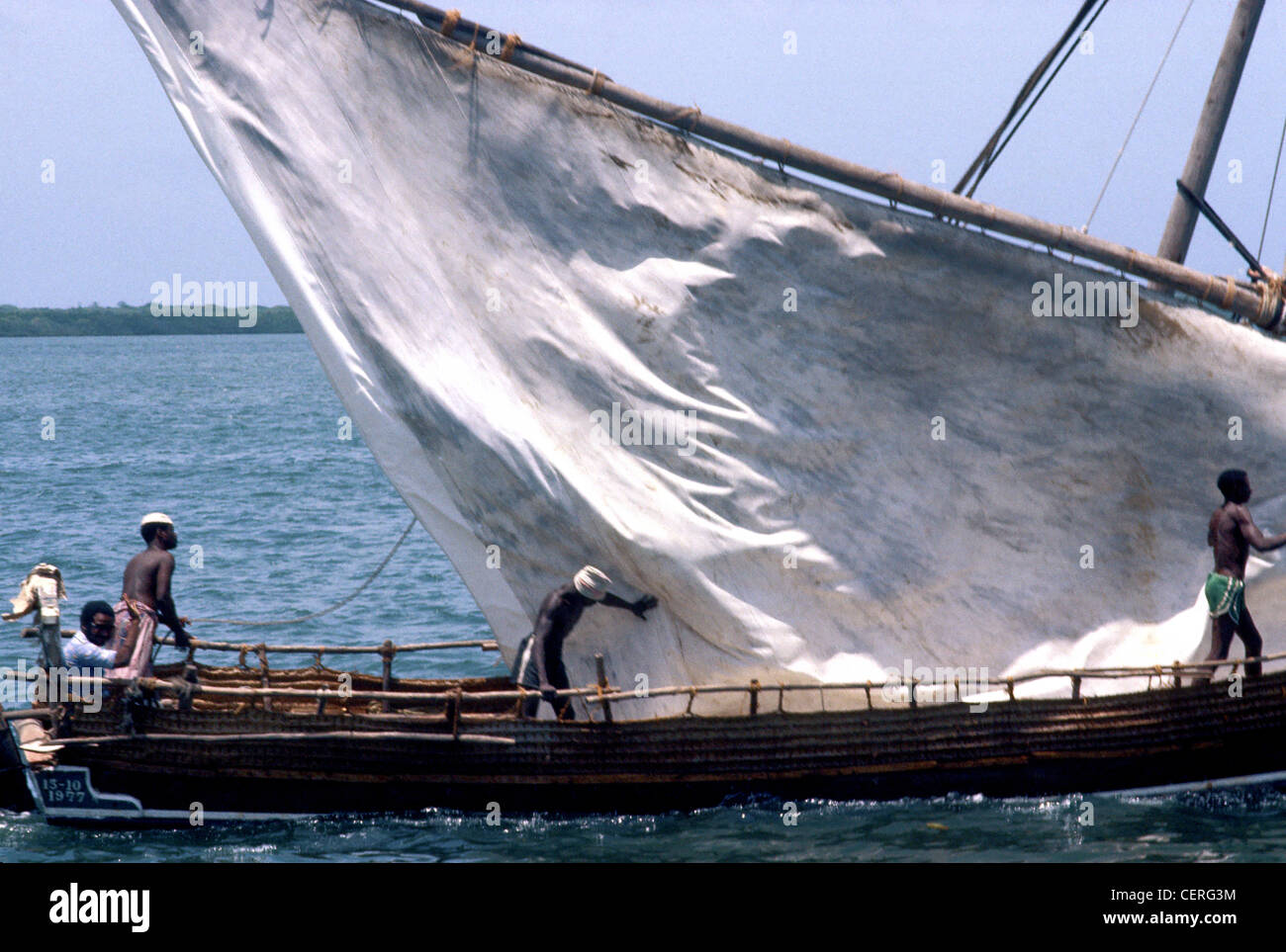 Raising a sail by Lamu, Kenya Stock Photo - Alamy